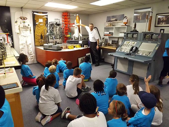 The best classrooms have rocket parts. These students are experiencing history firsthand from guides who understand that space exploration is best taught with wide-eyed wonder.