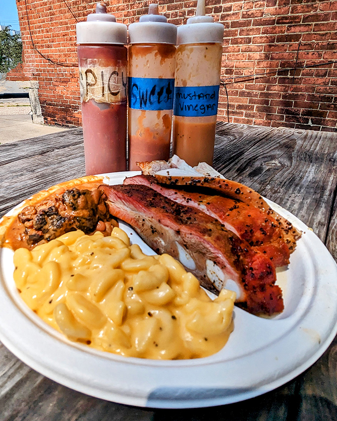 The holy trinity: perfectly smoked meat, house-made sauces, and mac and cheese that could make a grown person weep. Barbecue bliss, defined.