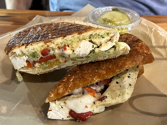 Cut into this Tuscan chicken panini and watch cheese stretch like it's auditioning for a food commercial. Comfort food with an Italian accent.