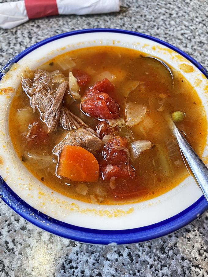 Steam rises from this vegetable beef soup like a savory fog, promising comfort by the spoonful and curing whatever might ail you.