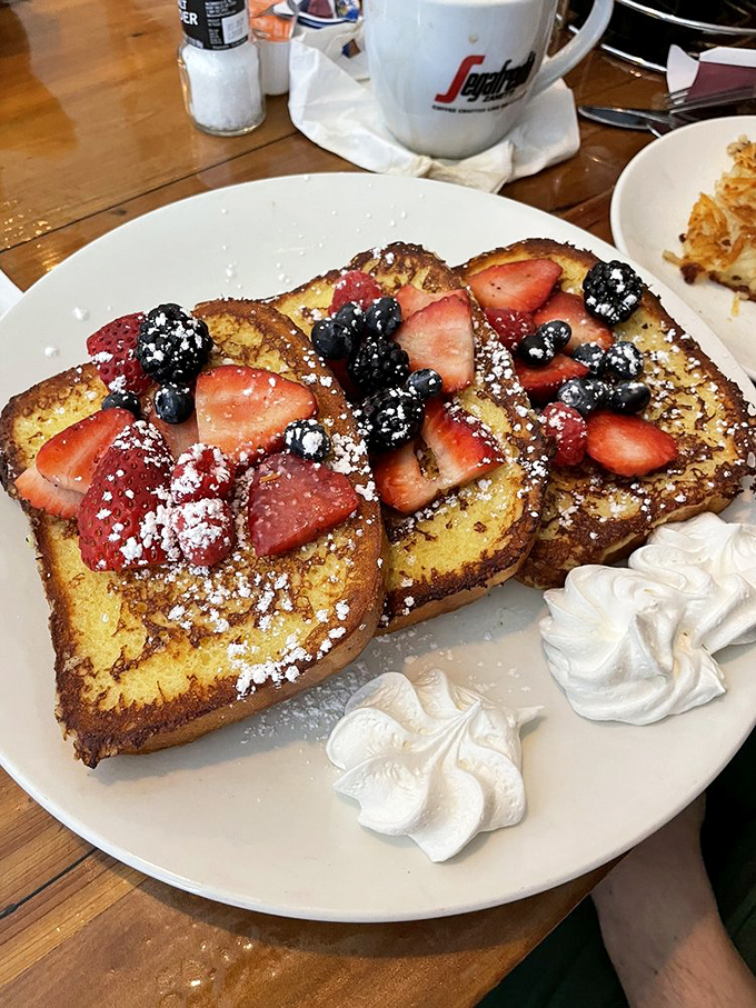 French toast that doubles as a berry delivery system&mdash;proving that bread's highest calling is to be soaked, griddled, and fruit-topped.