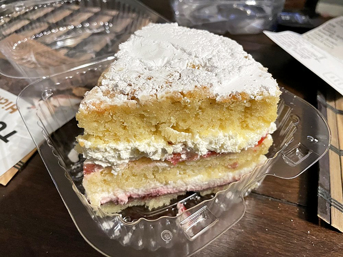 This Victoria Sponge looks like it just stepped out of Buckingham Palace &ndash; royally dusted with powdered sugar and hiding jammy secrets within.