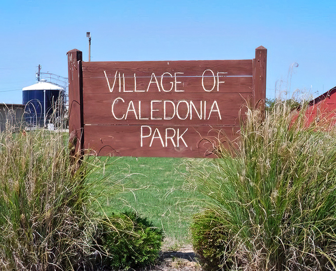 Village of Caledonia Park sign &ndash; where tall grasses frame a welcome to community gatherings that haven't changed much in fifty years.