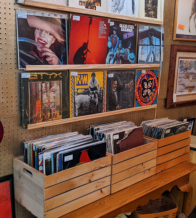 Album art as wall art&mdash;vinyl records displaying their colorful sleeves like badges of musical honor. The soundtrack of generations stored in wooden crates.