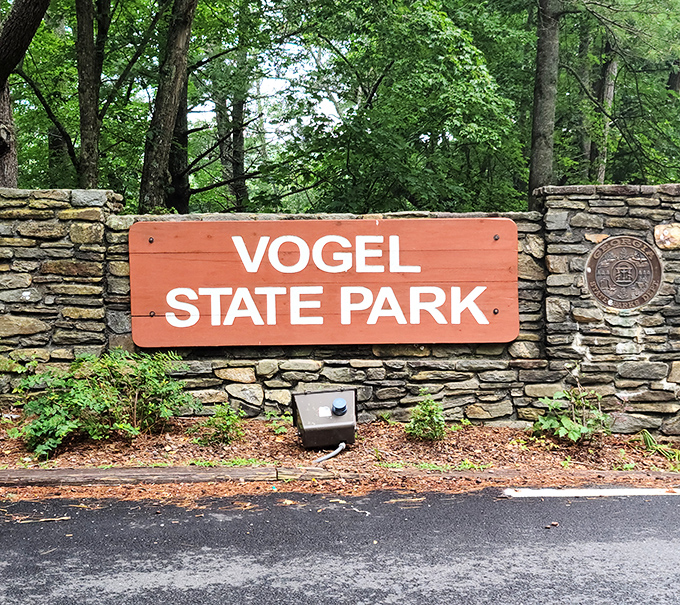 The entrance sign stands as both welcome and promise&mdash;beyond these stones lies an escape from everything that beeps, pings, or demands.