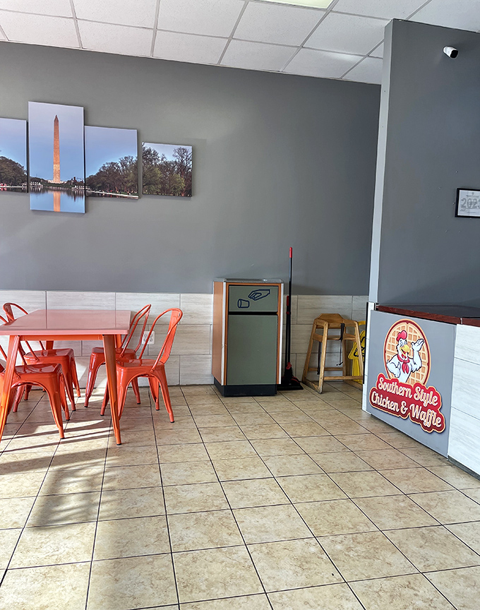 Those bright orange chairs pop against gray walls adorned with DC landmarks—a perfect blend of Southern cooking in the Commonwealth.
