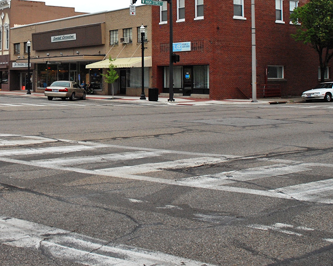 Street corners in Bryan invite pedestrians to slow down and absorb small-town rhythms, where crossing the street isn't a danger sport.