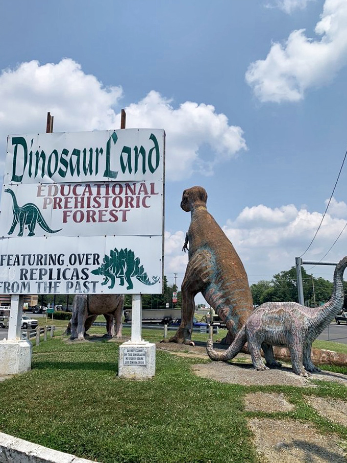 The roadside sign promises "Educational Prehistoric Forest," delivering exactly what it advertises with charming mid-century flair.