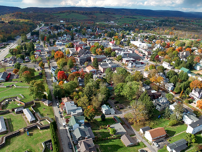 From above, Ligonier reveals its perfect small-town layout, nestled in the Laurel Highlands with autumn colors painting the surrounding countryside in nature's finest palette.