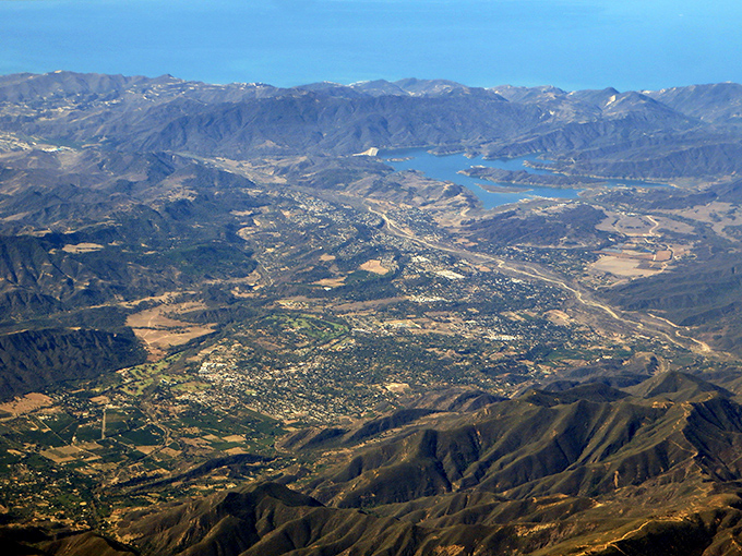 From above, Ojai reveals its perfect nestling in the valley, surrounded by protective mountains like a precious gem in nature's setting.