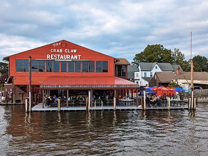From the water, The Crab Claw looks like a red beacon of culinary hope, promising the kind of meal that makes memories last longer than sunburns.