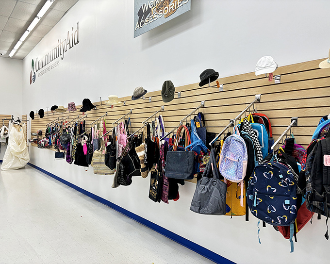 Bags and backpacks hang like colorful fruit, ready to be plucked by savvy shoppers who know quality doesn't always require a designer label.