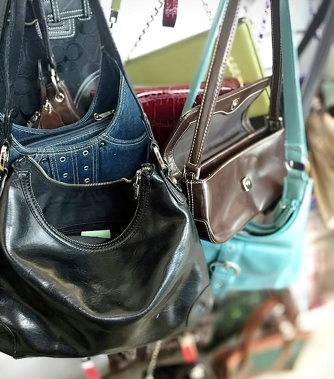 Handbag heaven for the fashionista on a budget. That teal crossbody is practically whispering, "Take me home and tell everyone I'm vintage designer."