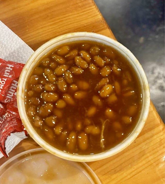 These baked beans might play a supporting role, but they're the unsung heroes providing sweet, smoky balance to the chicken's fiery performance.