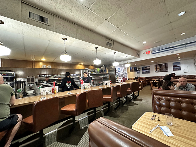 The counter seats offer front-row tickets to the breakfast theater, where every order tells its own story.