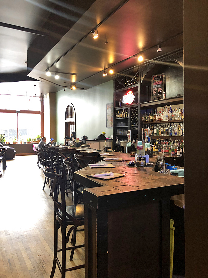 The bar area whispers promises of brunch cocktails while maintaining the warm, inviting atmosphere that makes Gailey's feel like breakfast's natural habitat.