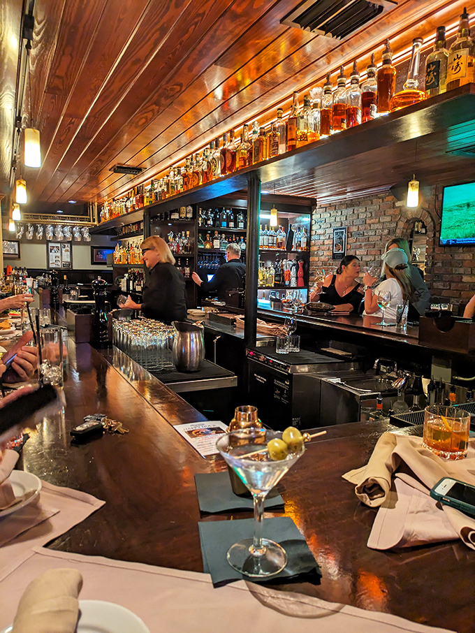 A bar where everybody might not know your name yet, but they'll remember how you like your Manhattan. Warm wood and amber bottles create liquid artwork.