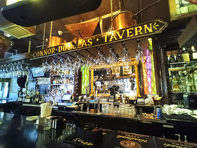 The tavern section boasts a bar straight out of a vintage movie, where glasses hang like crystal stalactites ready to catch whatever libation you fancy.