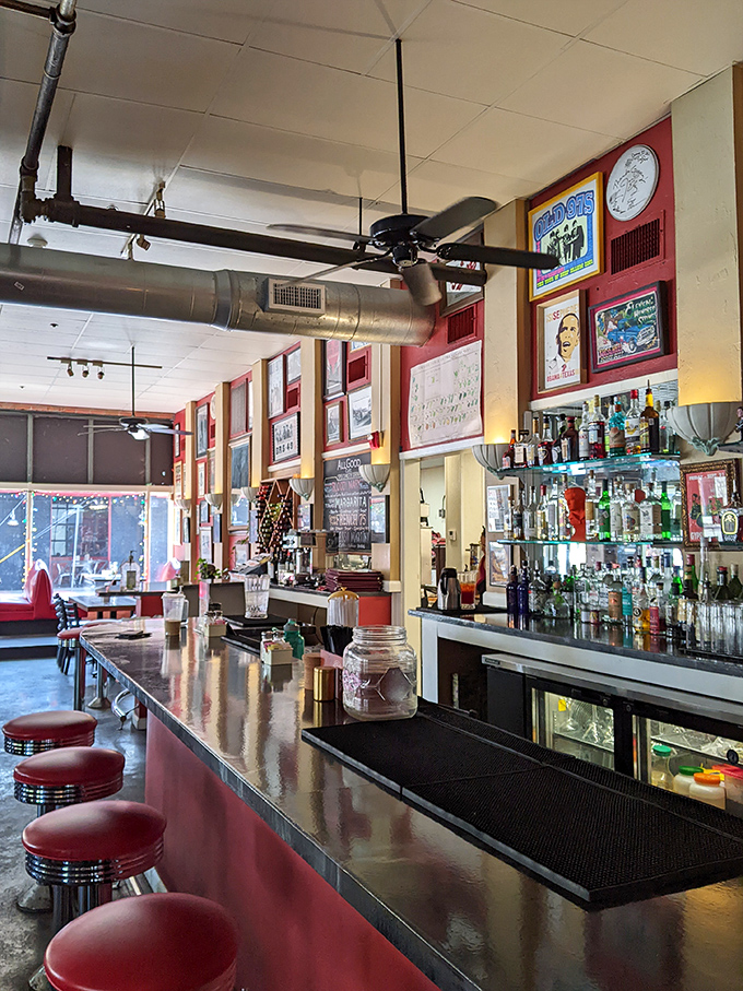 The polished bar counter reflects decades of conversations, laughter, and perfectly crafted comfort food memories. 