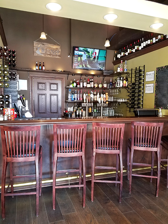 The well-stocked bar stands ready for that moment when you realize great pizza deserves an equally worthy beverage companion.