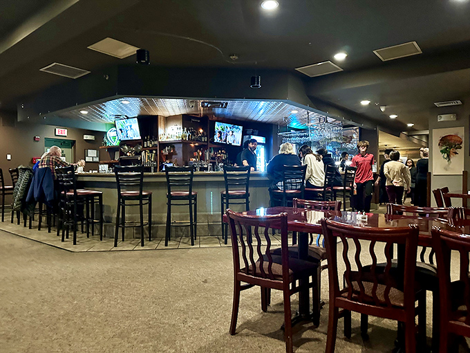 The bar area offers front-row seats to the liquid artistry, where conversations flow as freely as the drinks.