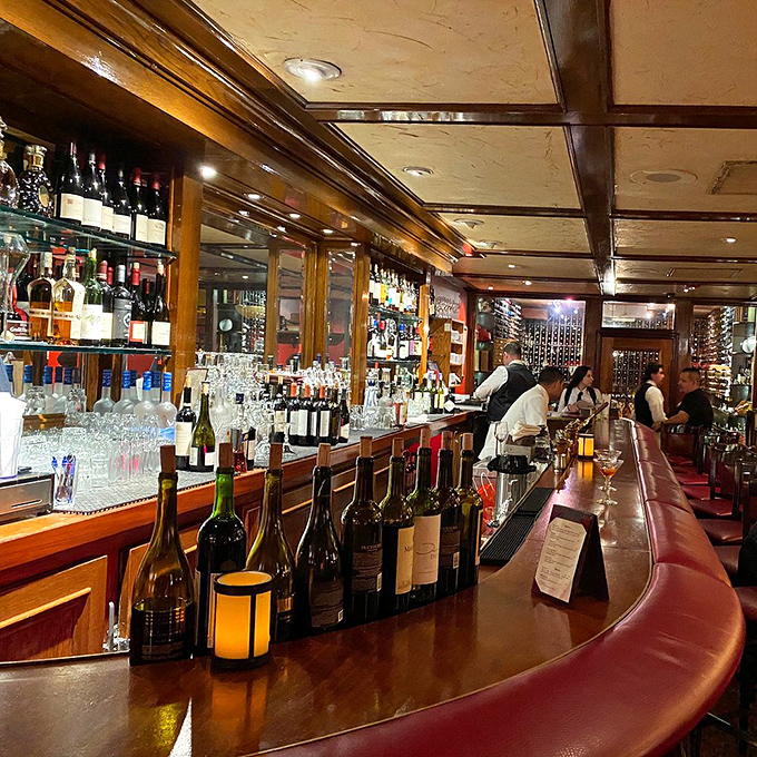 The bar gleams with bottles and polished wood &ndash; a perfect perch for sipping something strong while waiting for your table in the dining room beyond.