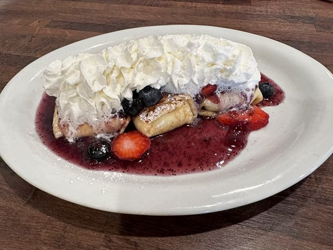 This berry-topped blintz with its mountain of whipped cream isn't just dessert masquerading as breakfast&mdash;it's breakfast elevated to art form.