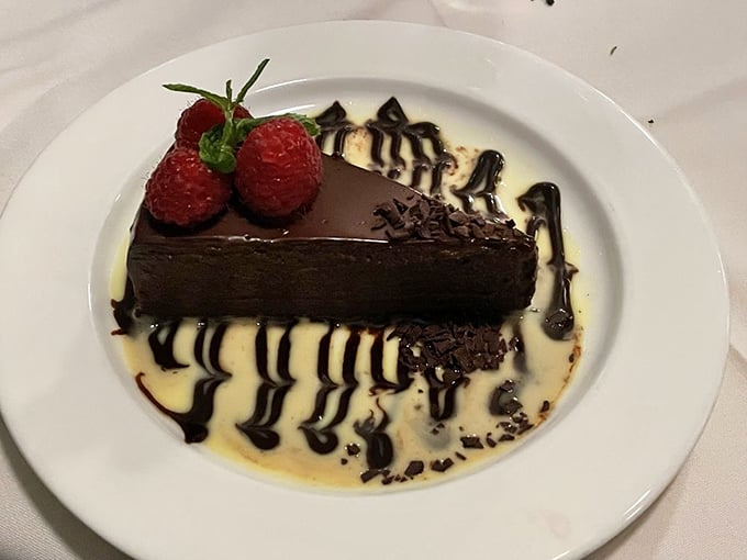 This chocolate dessert isn't just the final act—it's the standing ovation. Those raspberries aren't garnish; they're necessary supporting characters.