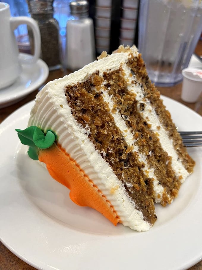 This towering slice of carrot cake with cream cheese frosting provides the perfect sweet ending to any meal.