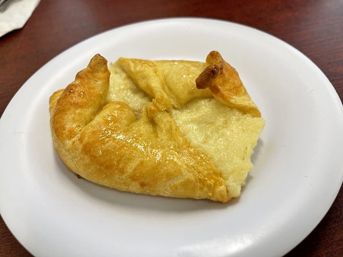 A cheese danish that whispers, "Forget the diet, remember the joy." Flaky, golden, and utterly worth breaking promises to yourself.