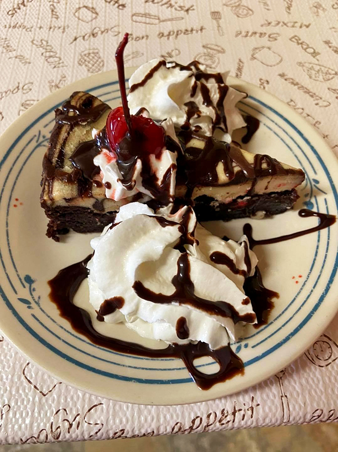 Chocolate cheesecake drizzled with sauce and crowned with whipped cream and a cherry&mdash;dessert that doesn't just end a meal, but makes it legendary.