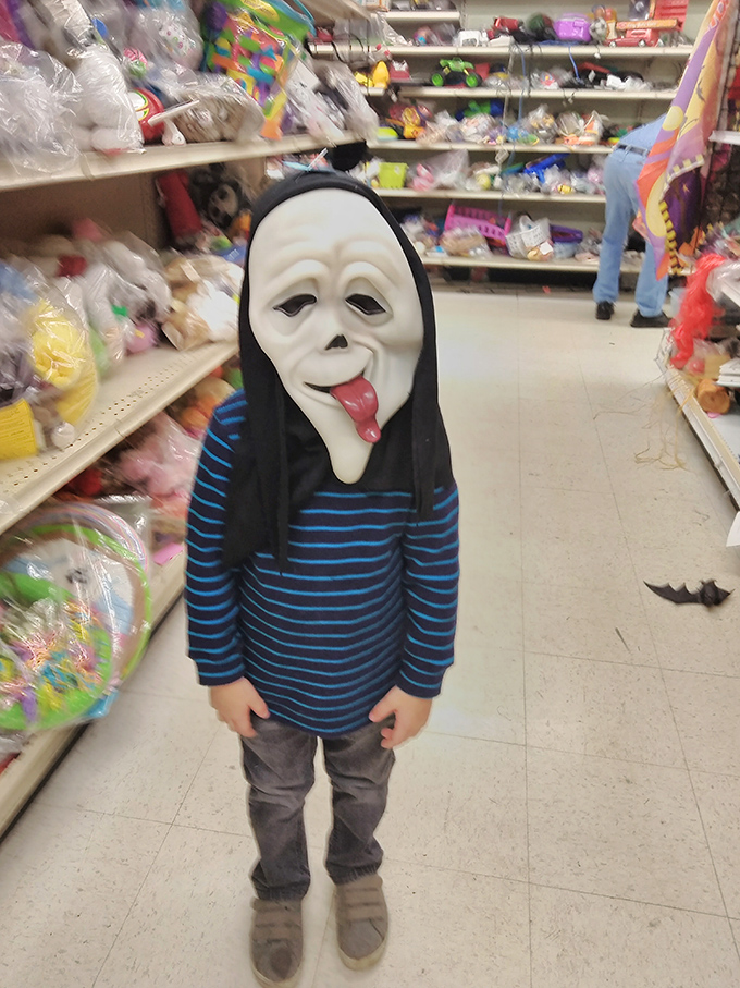 Halloween comes alive in the costume aisle! This little Scream enthusiast demonstrates why thrift stores are the ultimate destination for holiday transformation.