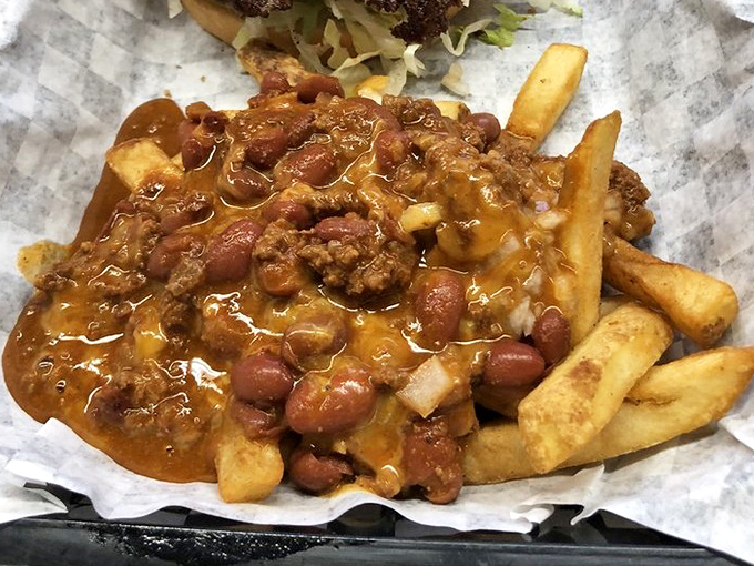 Chili cheese fries that laugh in the face of diet culture. A beautiful mess that requires both a fork and absolutely zero regrets. 