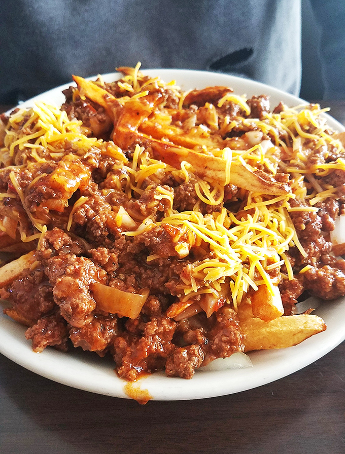 Chili cheese fries that laugh in the face of diet plans&mdash;a glorious mess that demands to be shared but rarely is.
