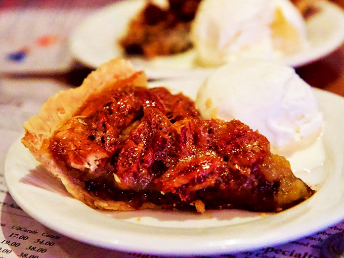 Chocolate pecan pie slice that could make grown adults weep tears of pure sugary joy.