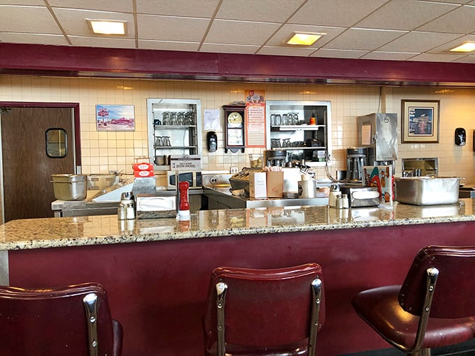 The counter where magic happens. These red stools have supported generations of Delawareans waiting for milkshakes, burgers, and the comfort that only classic diners provide.