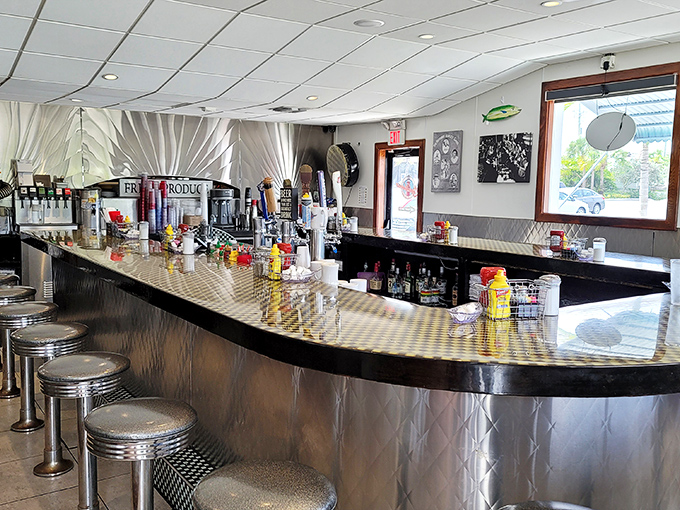 Where breakfast magic happens! The counter seating offers front-row tickets to the short-order symphony that makes Lighthouse Diner legendary.