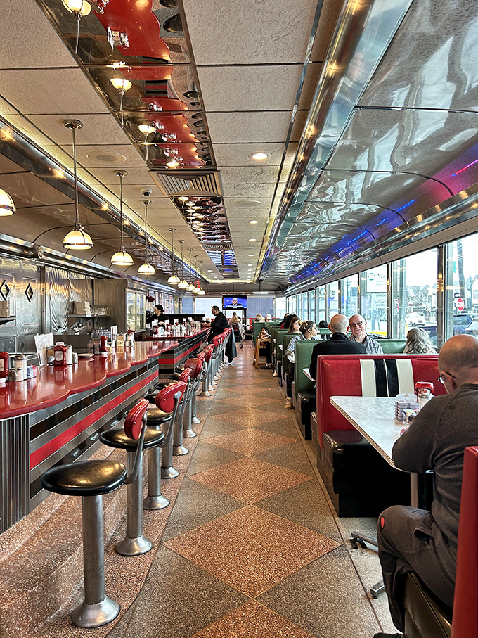 The heartbeat of Mayfair: chrome stools, counter service, and conversations that flow as freely as the coffee. Some call it a diner; regulars call it home.