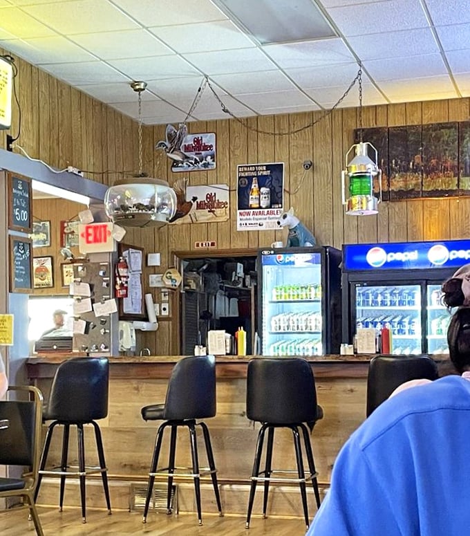 The counter seats offer front-row views to sandwich artistry. No chef's table at a Michelin-starred restaurant could offer a more satisfying spectacle.