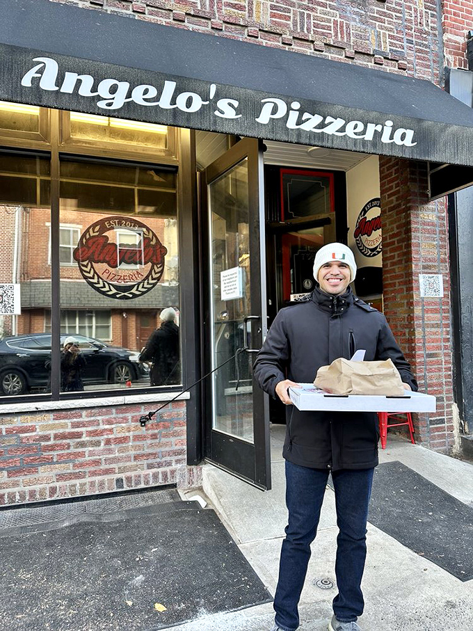 Victory has a face &ndash; and it's holding pizza boxes. The triumphant glow of someone who's about to become very popular at home.