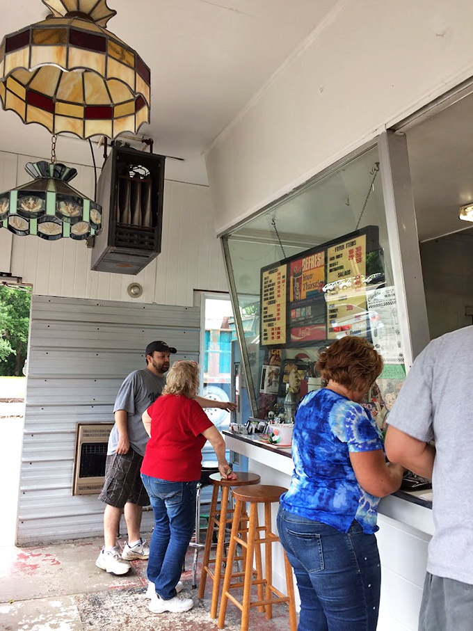 The ritual of ordering at the window creates a moment of anticipation that makes the eventual first bite all the more satisfying.