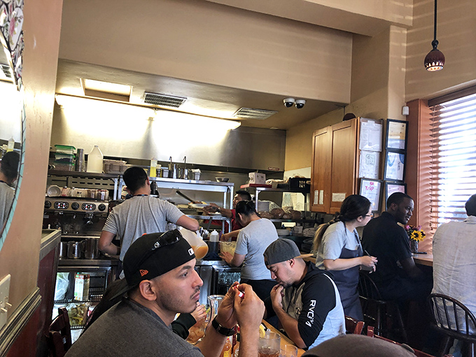 Happy customers discovering why this neighborhood gem has earned its devoted following through delicious food.