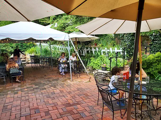 Dappled sunlight, happy diners, and the gentle buzz of conversation—this garden patio is where memories are made between bites of breakfast.