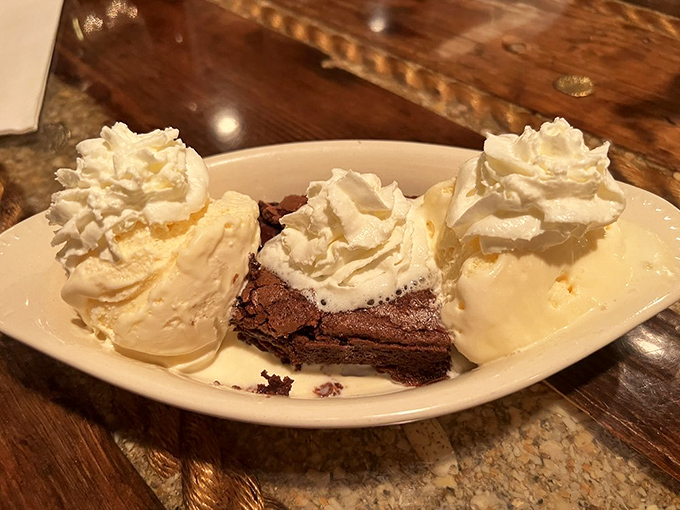 Brownie &agrave; la mode: where warm chocolate meets cold ice cream in a dessert romance for the ages. The whipped cream is just showing off at this point.