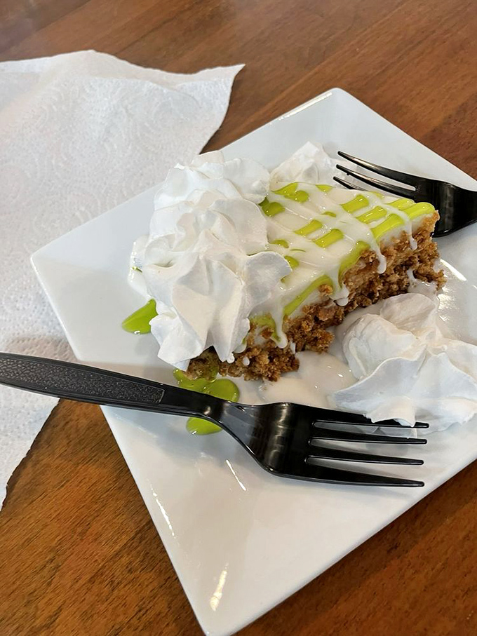 Key lime pie with a mountain of whipped cream—the perfect sweet-tart finale to a seafood symphony. Florida's signature dessert done right.