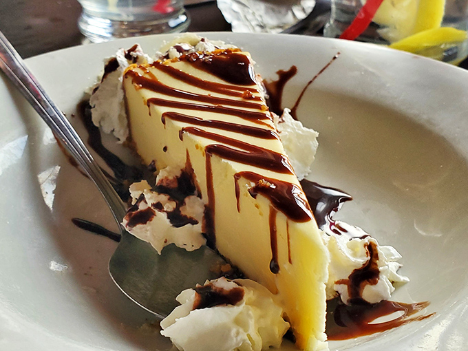 The grand finale: a slice of cheesecake drizzled with chocolate that somehow finds room in your stomach even after a cowboy-sized meal.