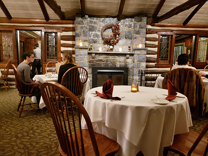 White tablecloths, stone fireplace, and happy diners &ndash; the dining room feels like you've been invited to a fabulous dinner party in someone's home.