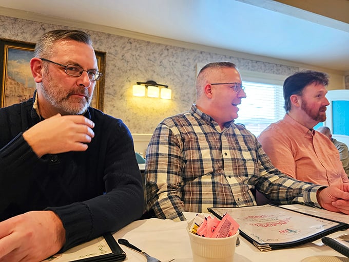 Happy diners deep in conversation &ndash; the true measure of any great restaurant isn't just the food, but the connections and memories created around the table.