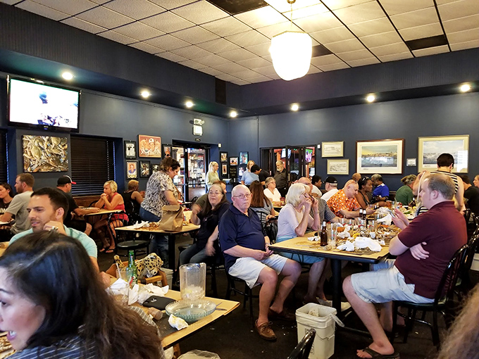 A packed house on a typical evening&mdash;where locals and visitors unite in the universal language of "pass the crab mallet."