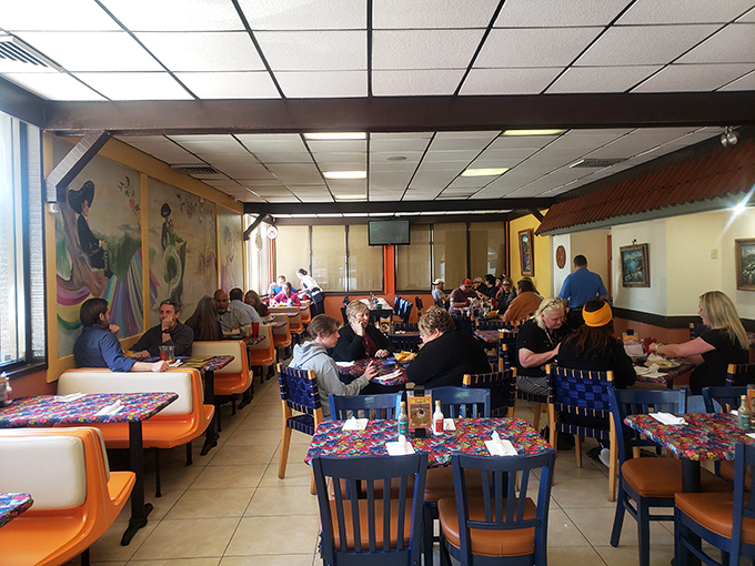 A full dining room speaks volumes&mdash;these aren't just customers, they're regulars who've found their happy place in a booth at Tapatio's.
